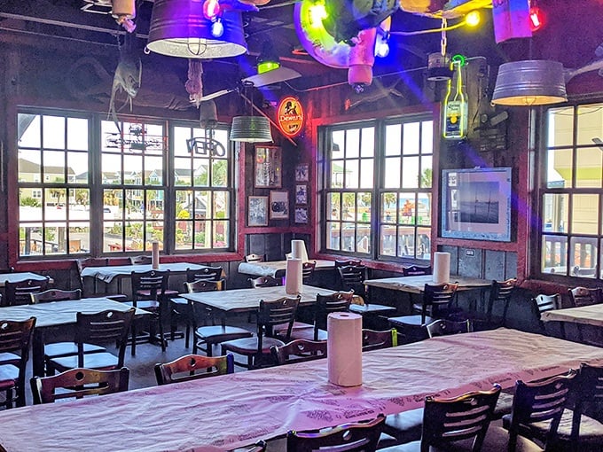String lights and galvanized bucket fixtures create the perfect backdrop for seafood feasts. No interior designer needed – just decades of authentic coastal character.