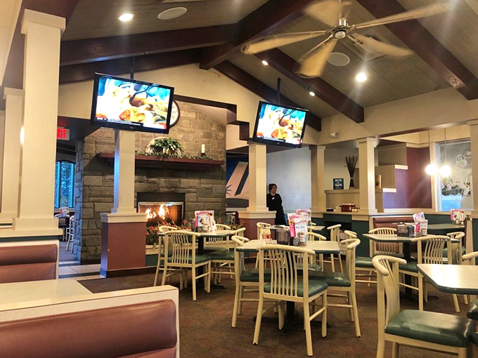 Stone fireplace, wooden beams, and comfortable seating—this isn't just dining, it's a warm embrace after a long day. The kind of place where memories are made between bites.