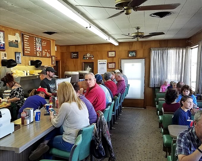 Counter seating that tells stories—where strangers become friends and regulars become family, all united by the pursuit of burger perfection.