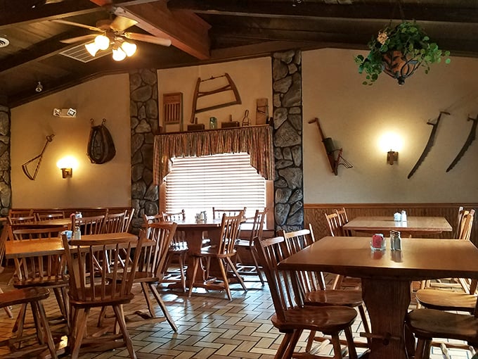 The dining room's stone accents and vintage farm implements create the perfect backdrop for serious eating – like dining in your outdoorsy uncle's trophy room.