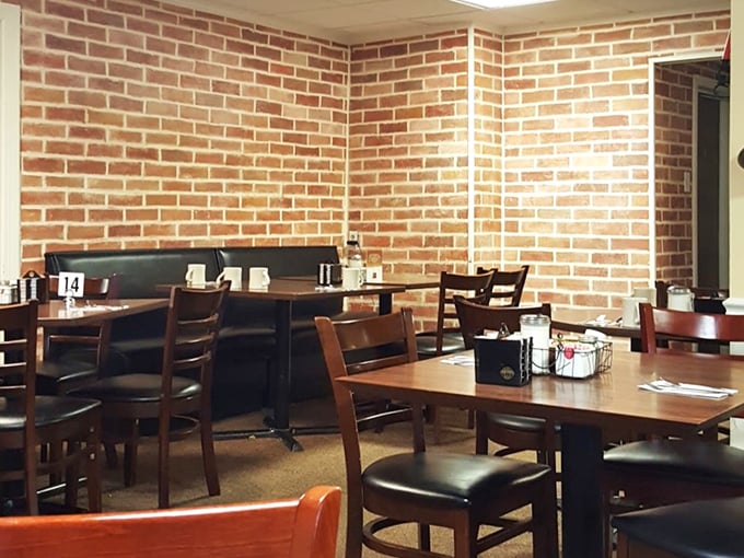 Exposed brick walls and simple wooden tables create that rare atmosphere money can't buy – genuine small-town comfort without pretense.