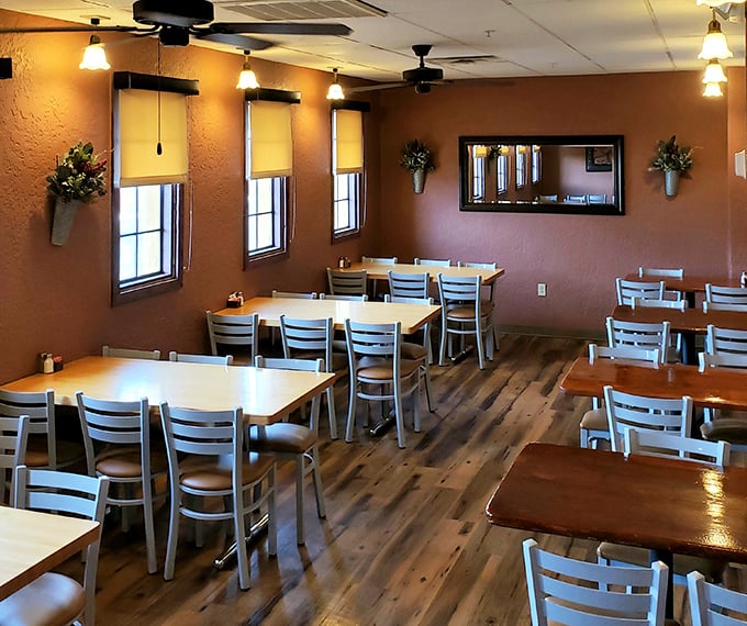 Simple wooden tables await diners in a warm, earthy interior where the focus is squarely where it should be—on the food that's about to arrive.