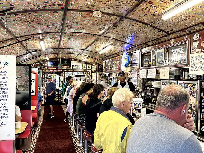 Dollar bills blanket the ceiling like a currency canopy while diners huddle at the counter—this isn't just breakfast, it's a Worcester institution in full swing.