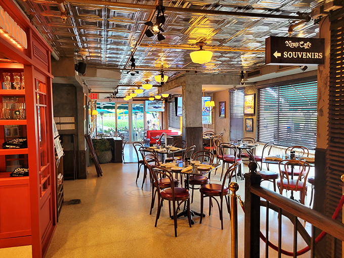 Step inside to discover a charming interior where vintage bentwood chairs and that stunning pressed tin ceiling transport you to a Parisian sidewalk café.