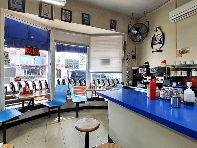 Inside, the penguin theme isn't subtle—it's a full-blown obsession that somehow makes your coffee taste better and your morning brighter.