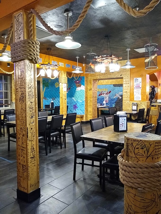 Nautical ropes, wooden beams covered in guest signatures, and ocean-blue murals—this isn't decoration, it's a full maritime immersion program.