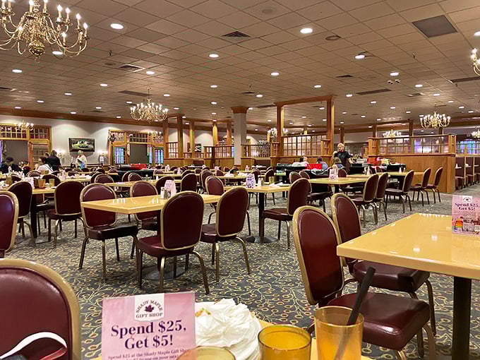 Inside, chandeliers cast a warm glow over a dining room that could host a small village. Your stomach is already sending thank-you notes.