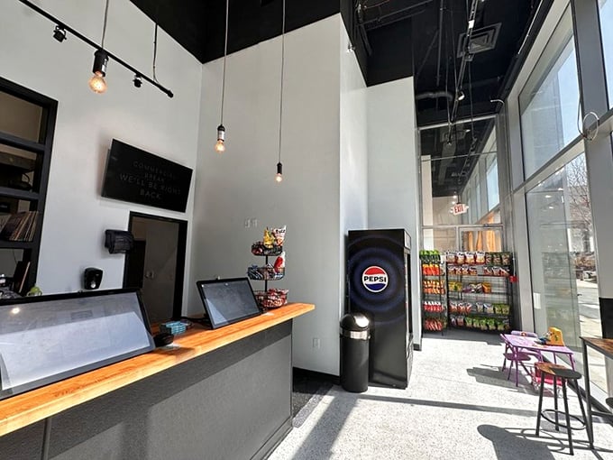 Minimalism meets maximum flavor. The clean interior with its pendant lights and wooden counter says, "We're serious about sandwiches, not décor."