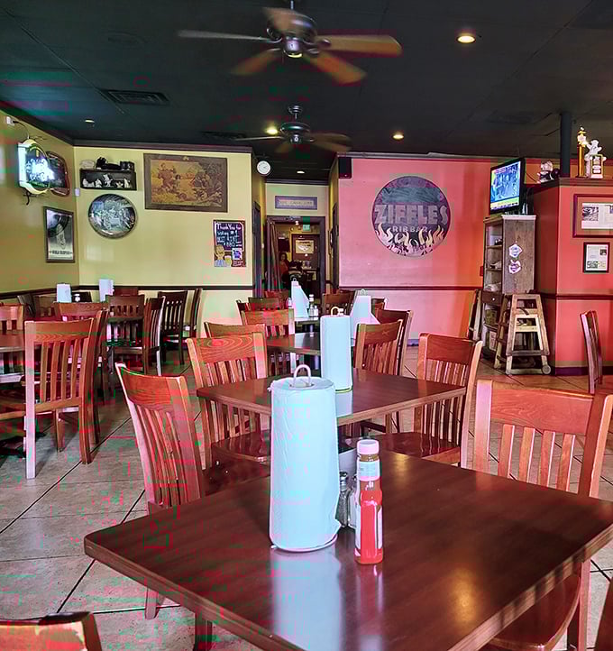 Red walls, wooden chairs, and ceiling fans create that perfect "come as you are" vibe where napkins aren't just provided—they're absolutely necessary.