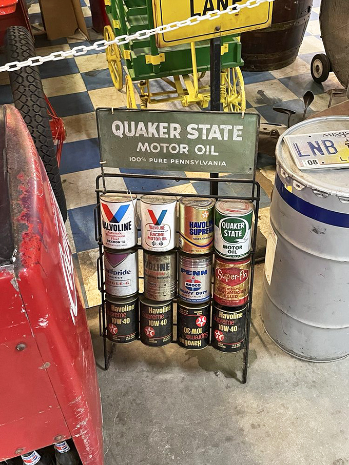 Motor oil never looked so collectible! This pristine display of vintage Quaker State and Valvoline cans takes you back to simpler automotive times.