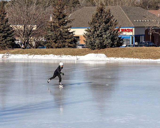 Winter in Minnesota isn't hibernation—it's transformation. This lone skater gliding across frozen waters embodies the state's "embrace the cold" philosophy better than any tourism brochure.