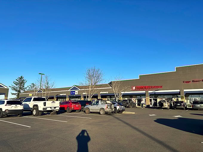 Traditional outlet architecture meets coastal charm, where parking spots are worth their weight in discounted gold.