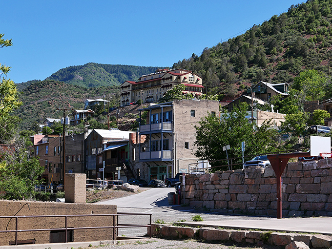 Buildings cling to Cleopatra Hill with the determination of stubborn mountain goats, creating a vertical neighborhood that defies both gravity and conventional city planning.