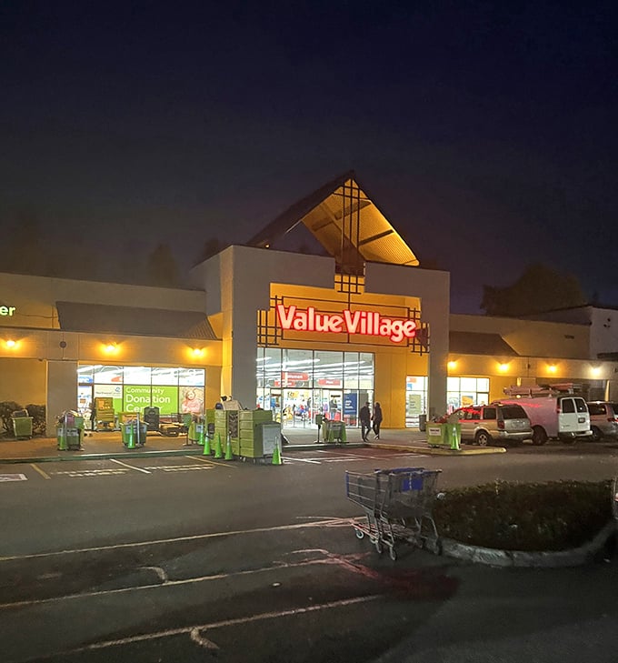 By night, the illuminated Value Village sign transforms into a beacon for night owls seeking retail therapy without the mall price tags.