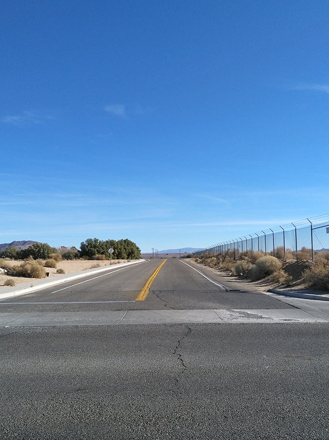 The open road stretches toward possibility, a quintessential California desert scene where traffic jams are something that happen to other people.