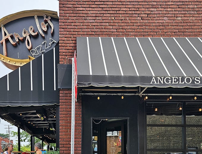 Angelo's storefront screams "serious pizza business happens here" with its no-nonsense brick and elegant awning combo.