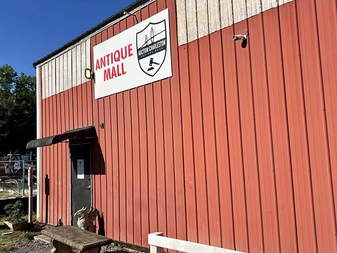 Behind this humble red barn exterior lies a wonderland where yesterday's treasures become today's perfect finds.