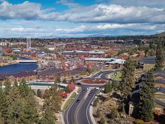 Bend's cityscape nestled against the mountains—where outdoor adventure meets urban comfort in perfect harmony.