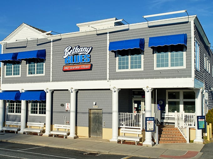 Those blue awnings match the ocean vibes perfectly – beach hair meets barbecue sauce, my favorite combo! 