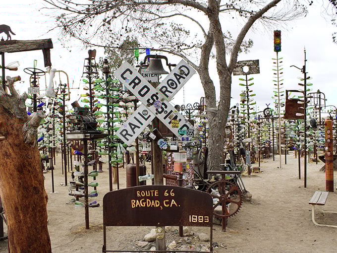 Metal trees adorned with colorful bottles create a tinkling forest of light and sound along Route 66.