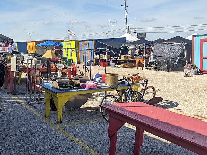 Outdoor treasure hunting at its finest - where vintage bicycles and painted tables create their own rainbow.