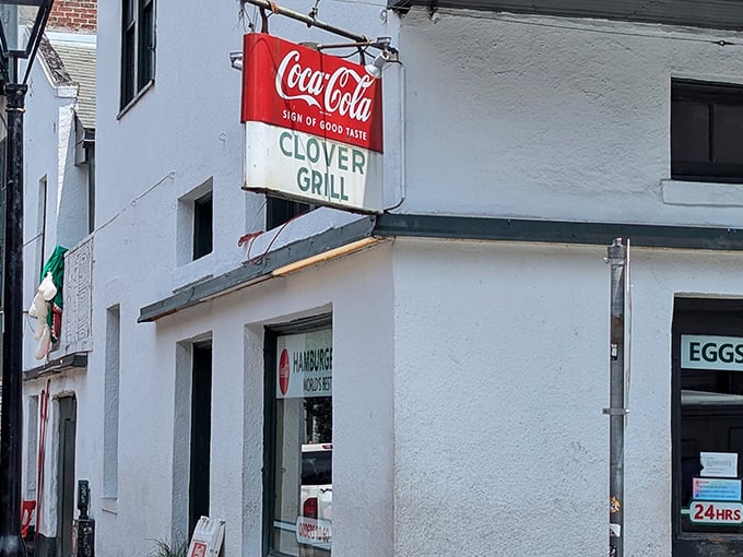 Classic diner dreams come true at Clover Grill, where that vintage Coca-Cola sign has witnessed decades of late-night breakfast salvation.