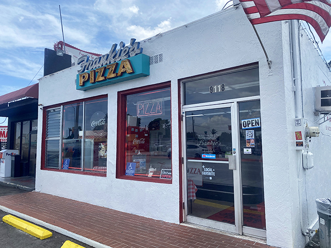 Frankie's neon sign glows like a beacon calling all pizza lovers home for dinner.