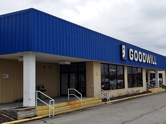 Goodwill's iconic blue building stands ready for treasure hunters—like a department store where everything has a story.