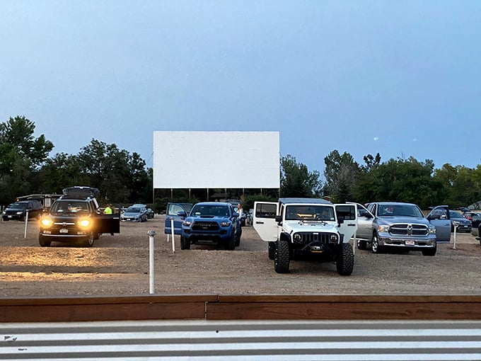 As dusk settles over the Holiday Twin Drive-In, cars line up and engines quiet in anticipation of the night’s feature under the open sky.