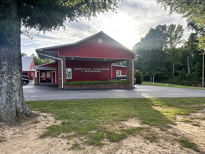 The big red barn of beef! Homestead Steakhouse stands proud against the countryside like a carnivore's lighthouse.