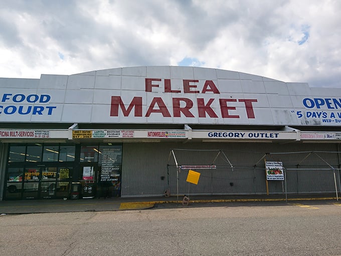 The massive "Flea Market" sign beckons bargain hunters to discover what deals await behind those doors.