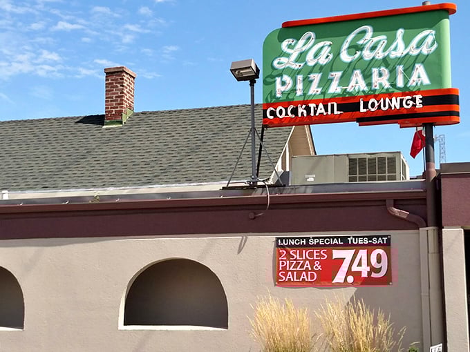 That vintage neon sign has been calling pizza lovers home for decades of delicious memories.