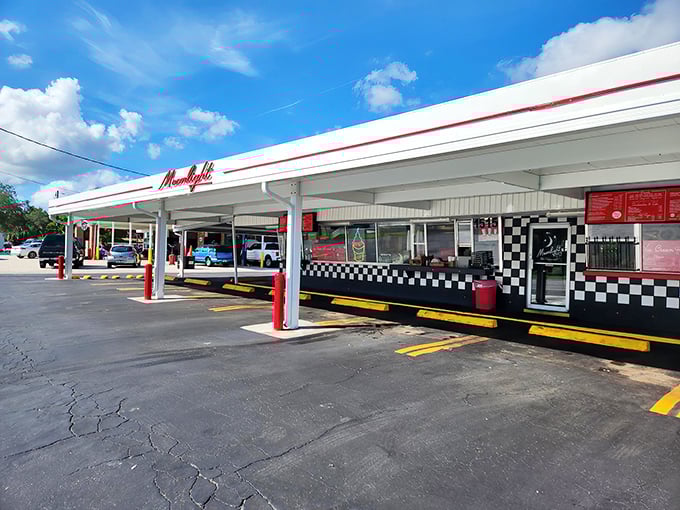 Moonlight Drive-In's classic black and white checkered facade promises a taste of yesteryear. Some places just get better with age!