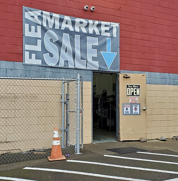 The entrance to Puyallup Flea Market beckons with its bold "FLEA MARKET SALE" sign – treasure hunting starts here!
