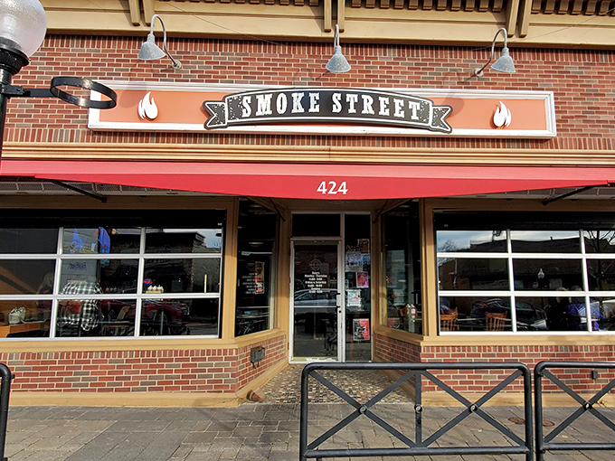 Smoke Street's brick-front charm and classic signage – where BBQ dreams come true in downtown Milford's most aromatic corner.