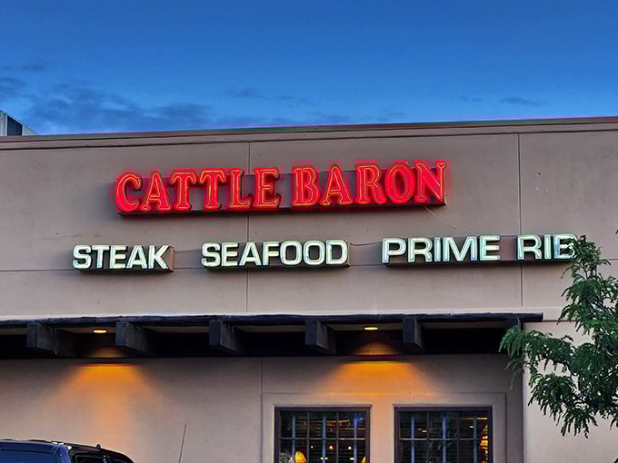 When those neon letters glow at night, locals know exactly where to find their perfectly cooked steak fix.