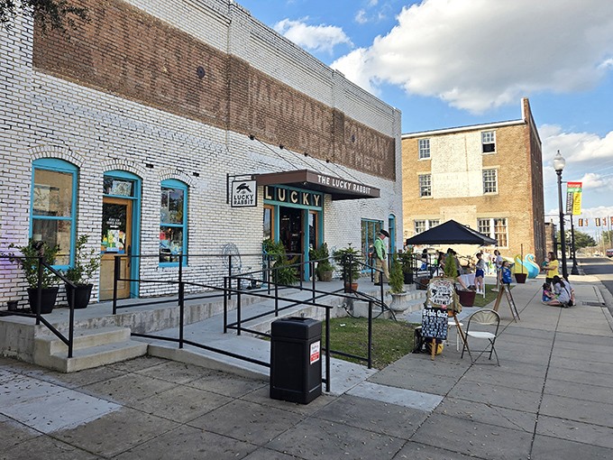 The Lucky Rabbit's turquoise-trimmed storefront brings downtown Hattiesburg charm with historic brick walls and welcoming character.