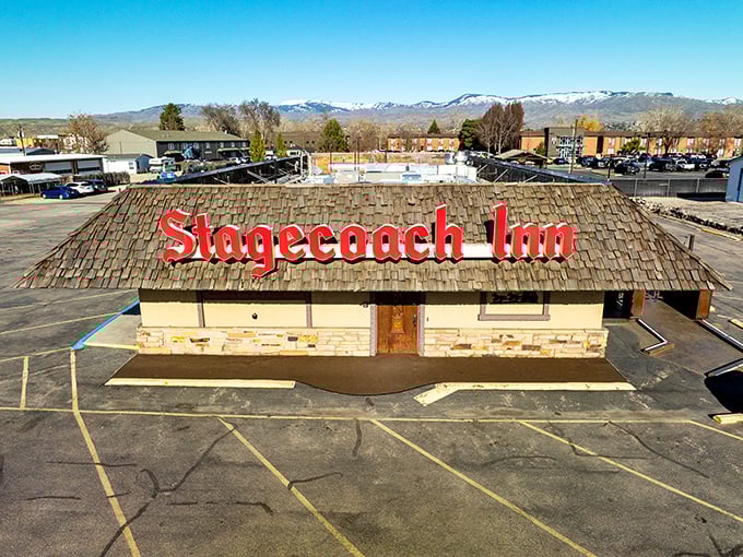 Welcome to flavor country! The Stagecoach Inn's retro sign promises beef adventures under that iconic wooden roof. 