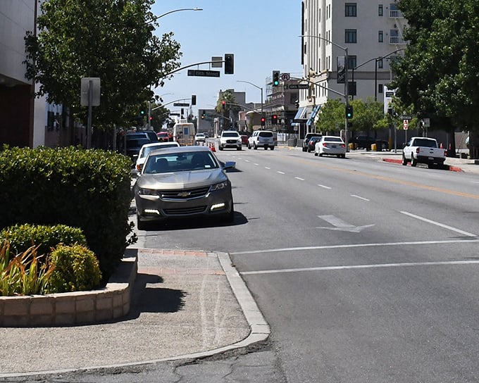 Sunlight glints off cars and storefronts along Bakersfield’s downtown street, where the city’s pulse beats strongest.