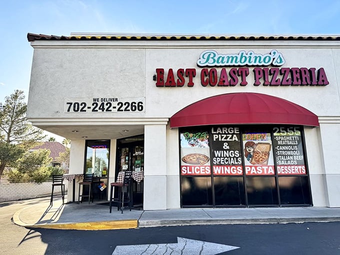 That bold red awning is like a culinary lighthouse guiding hungry souls to pizza salvation.
