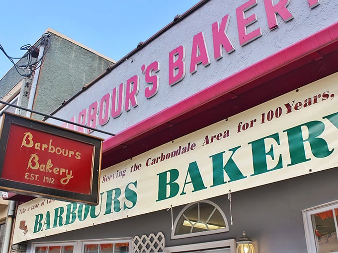 That classic pink and white storefront whispers promises of donuts that'll make your morning magical.