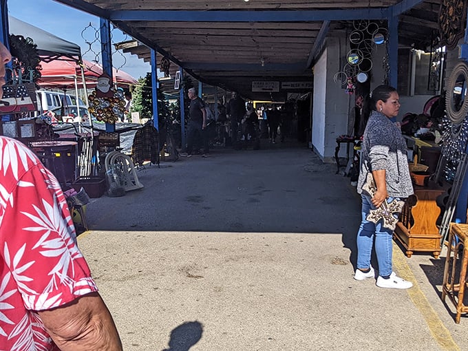 Covered walkways protect bargain hunters while they browse through endless rows of weekend market treasures.