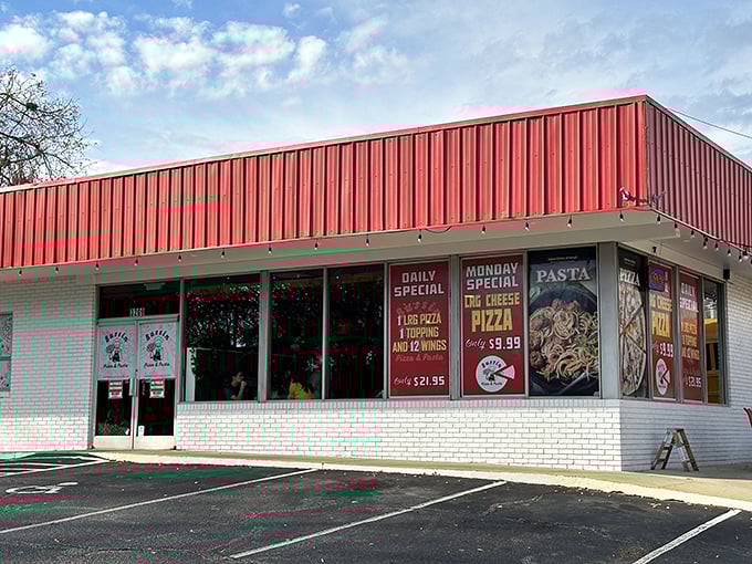 That classic pizza joint look! Behind those windows at Bussin Pizza, dough wizards are crafting the kind of pies that become weekly traditions.