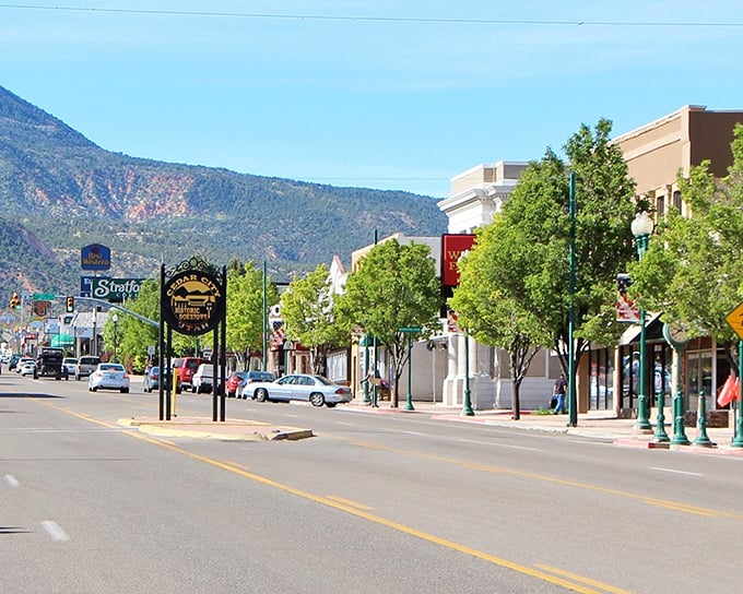 Mountain backdrops frame downtown streets like nature's own picture-perfect postcard setting.