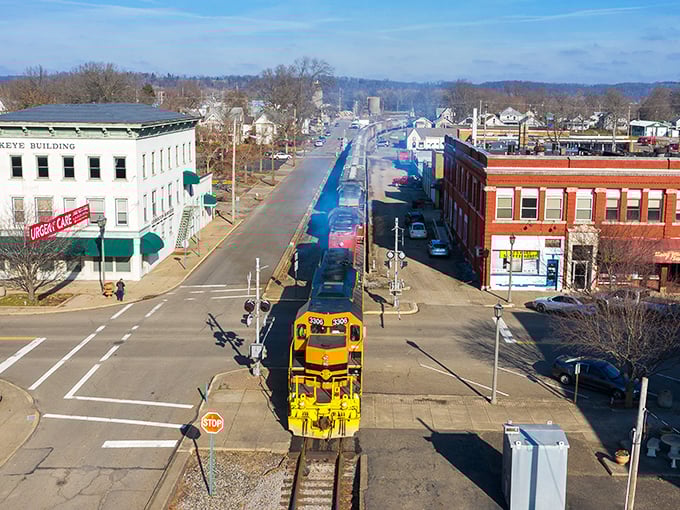Look at that yellow train cutting through downtown! Coshocton offers small-town charm with a side of "I can actually afford this."