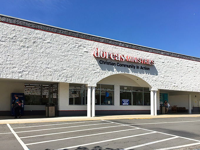White walls and welcoming windows signal a place where bargains meet genuine neighborly kindness.