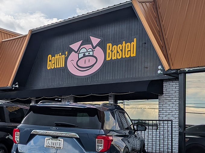 That grinning pig mascot knows something you don't—this place serves barbecue worth smiling about until your last bite.