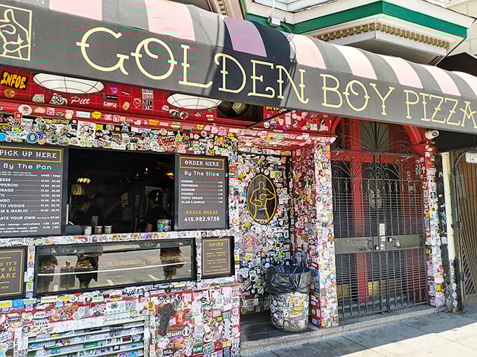 Pizza art meets street art at Golden Boy. Those pink and black stripes have been guiding hungry folks to pizza bliss since 1978.