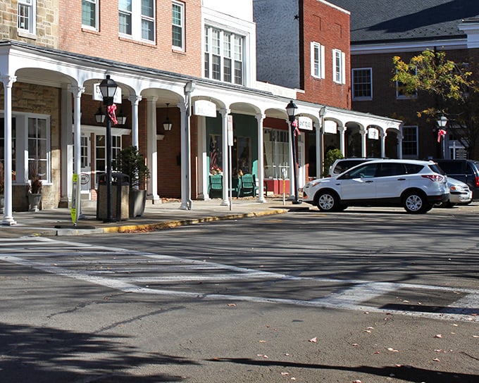 Those white columns stand like sentinels guarding the kind of main street America dreams about.