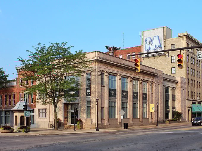 Main Street Mansfield—where traffic lights swing lazily overhead and nobody's honking if you stop to admire the architecture.